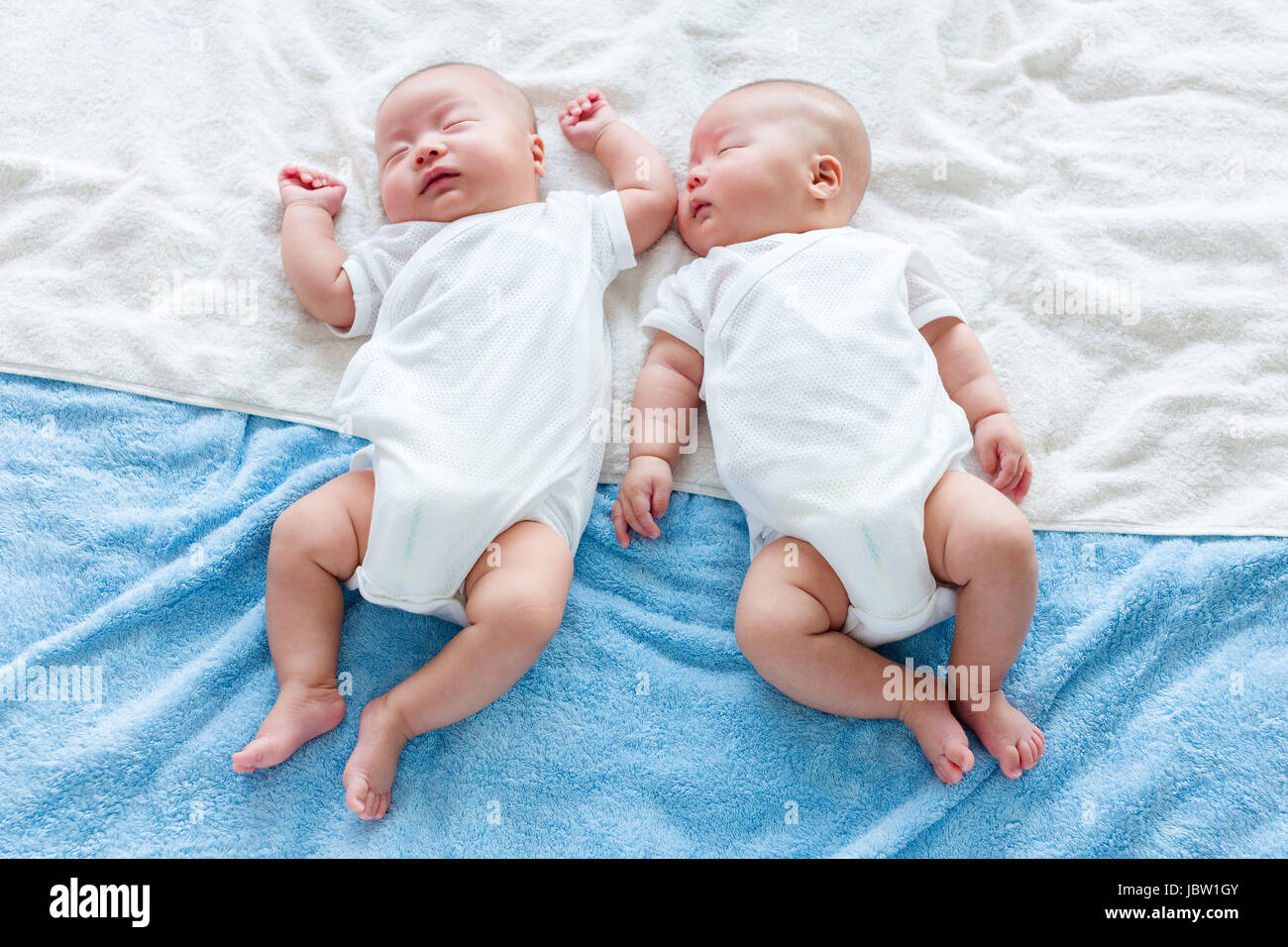 Adorable twin baby Stock Photo - Alamy