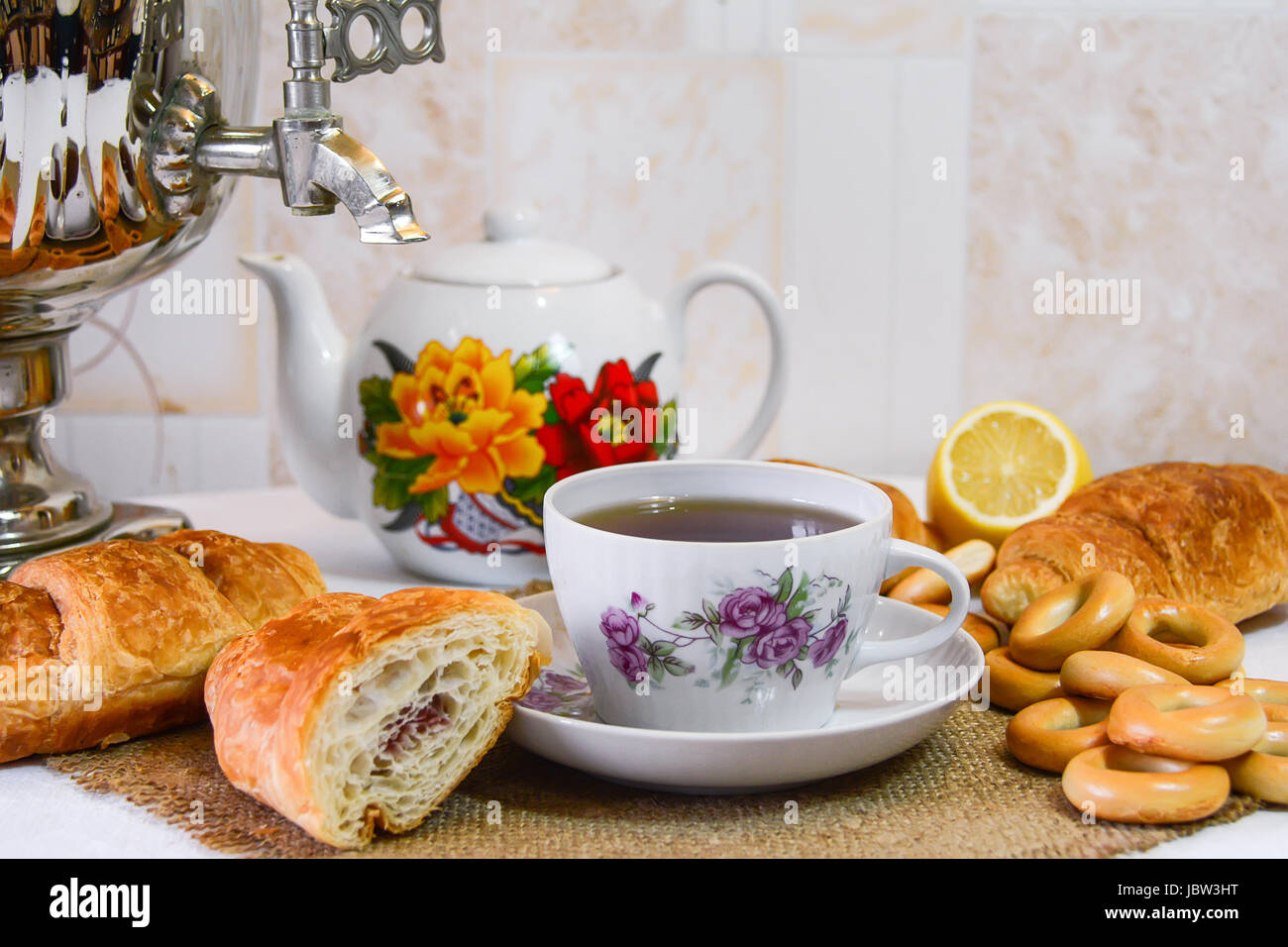 Tea from a samovar with sweet pastries Stock Photo - Alamy