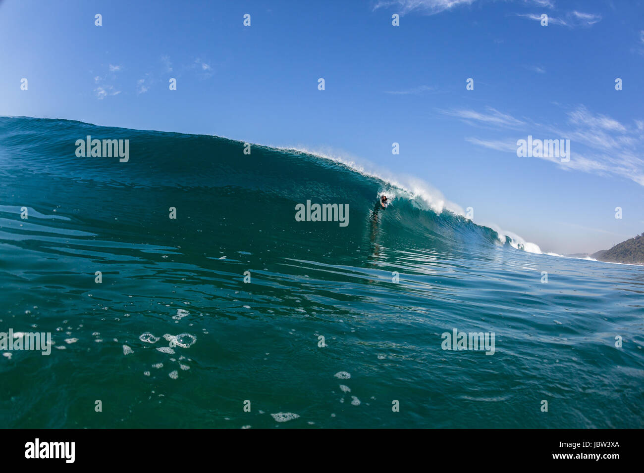 Surfing ride blue ocean sea wave swimming inside crashing hollow scenic ...