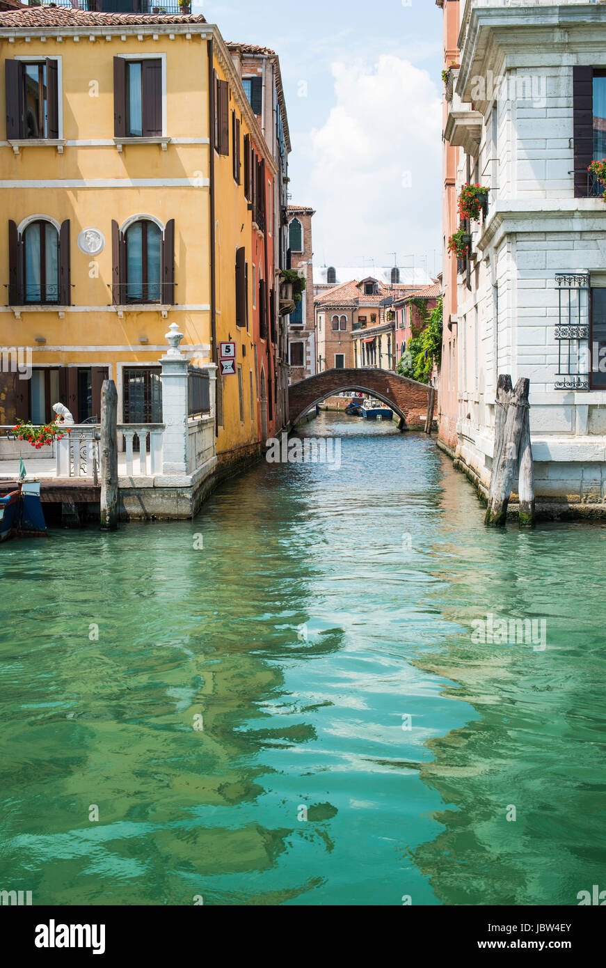 Ancient buildings in Venice. Boats moored in the channel. View from the ...