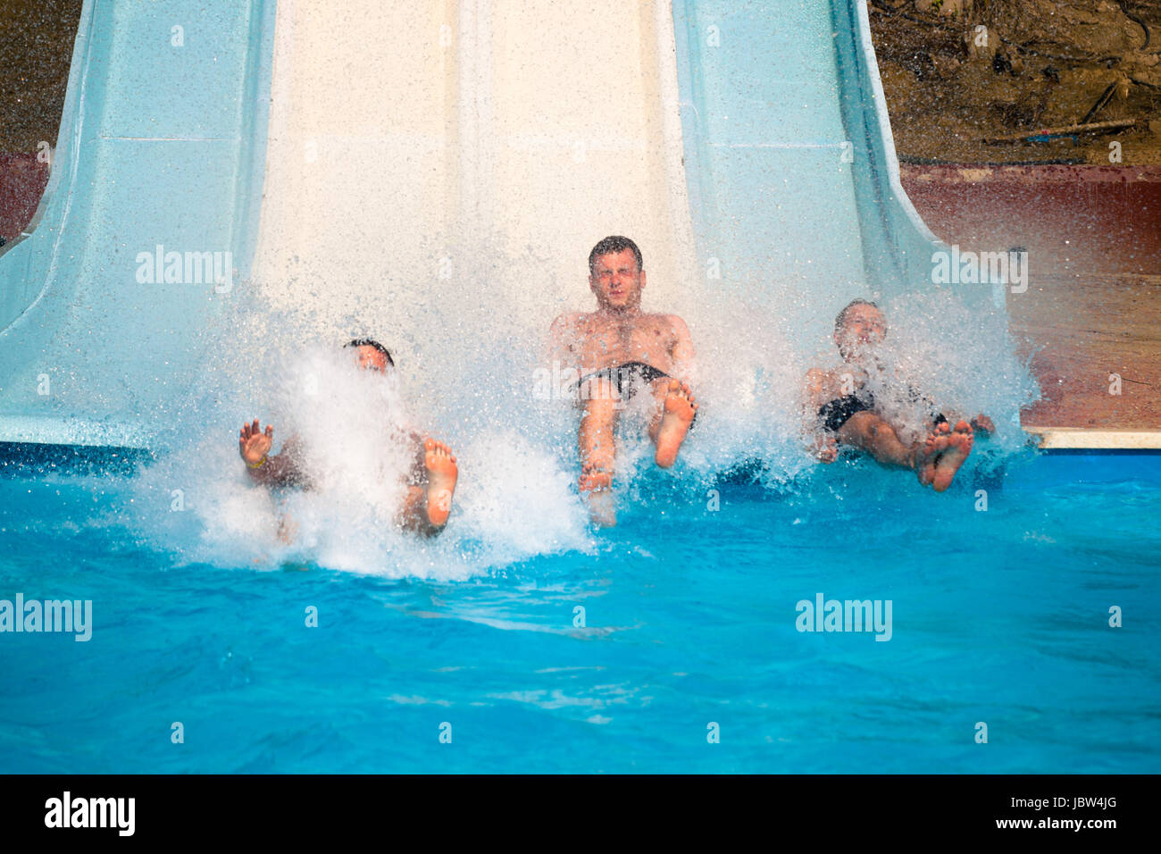 People water slide at aqua park Stock Photo - Alamy
