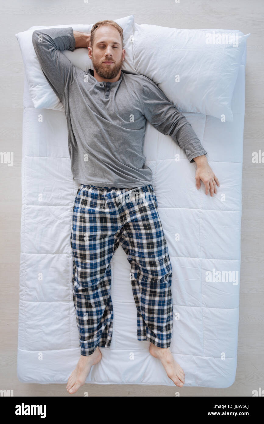 Handsome peaceful man sleeping Stock Photo - Alamy