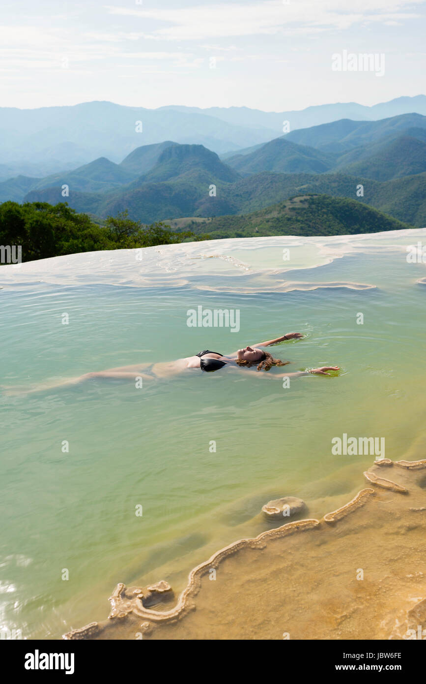 Woman floating in thermal spring, Hierve el Agua, Oaxaca, Mexico Stock ...