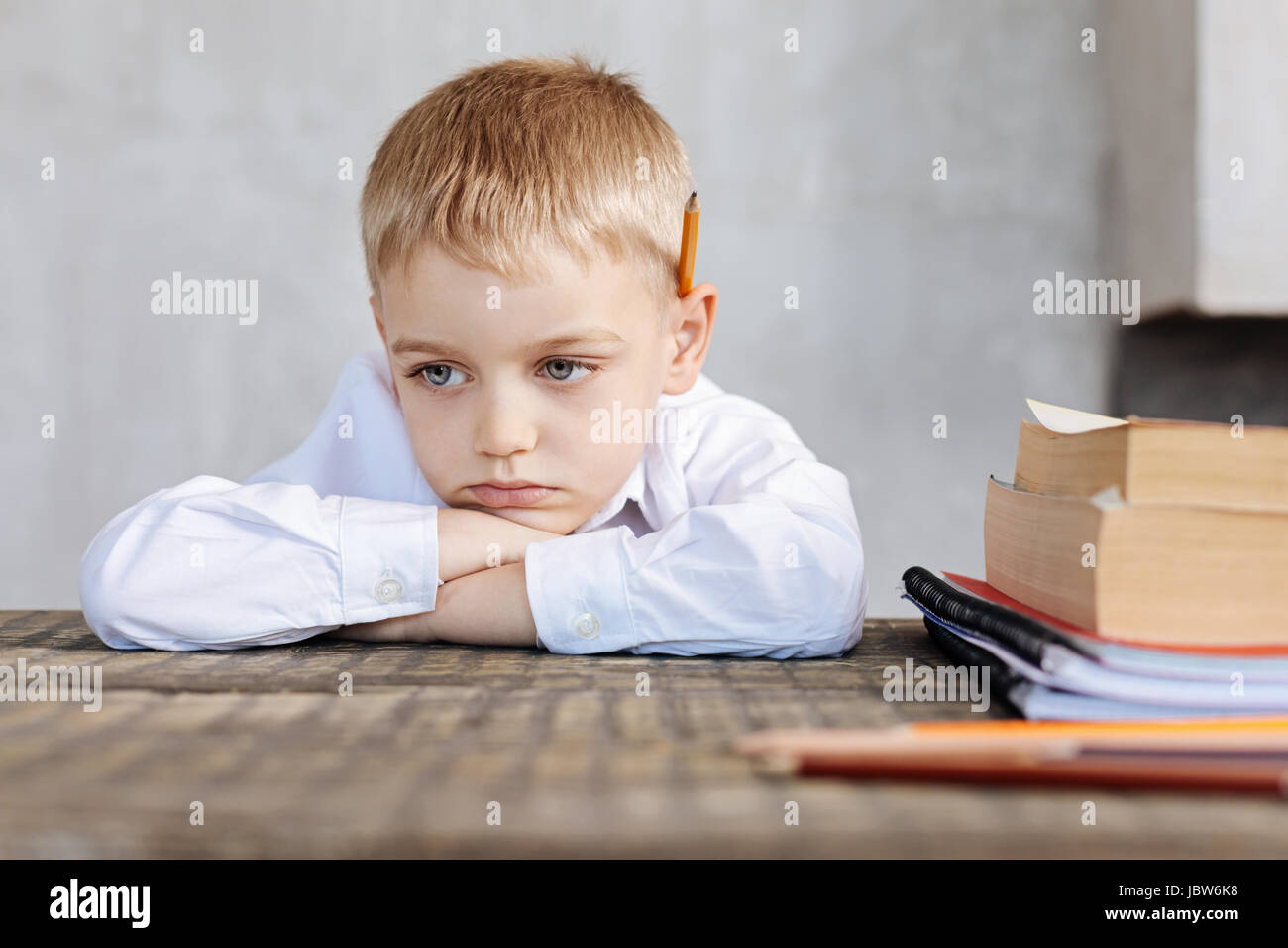 Sad sincere boy being a stubborn student Stock Photo - Alamy