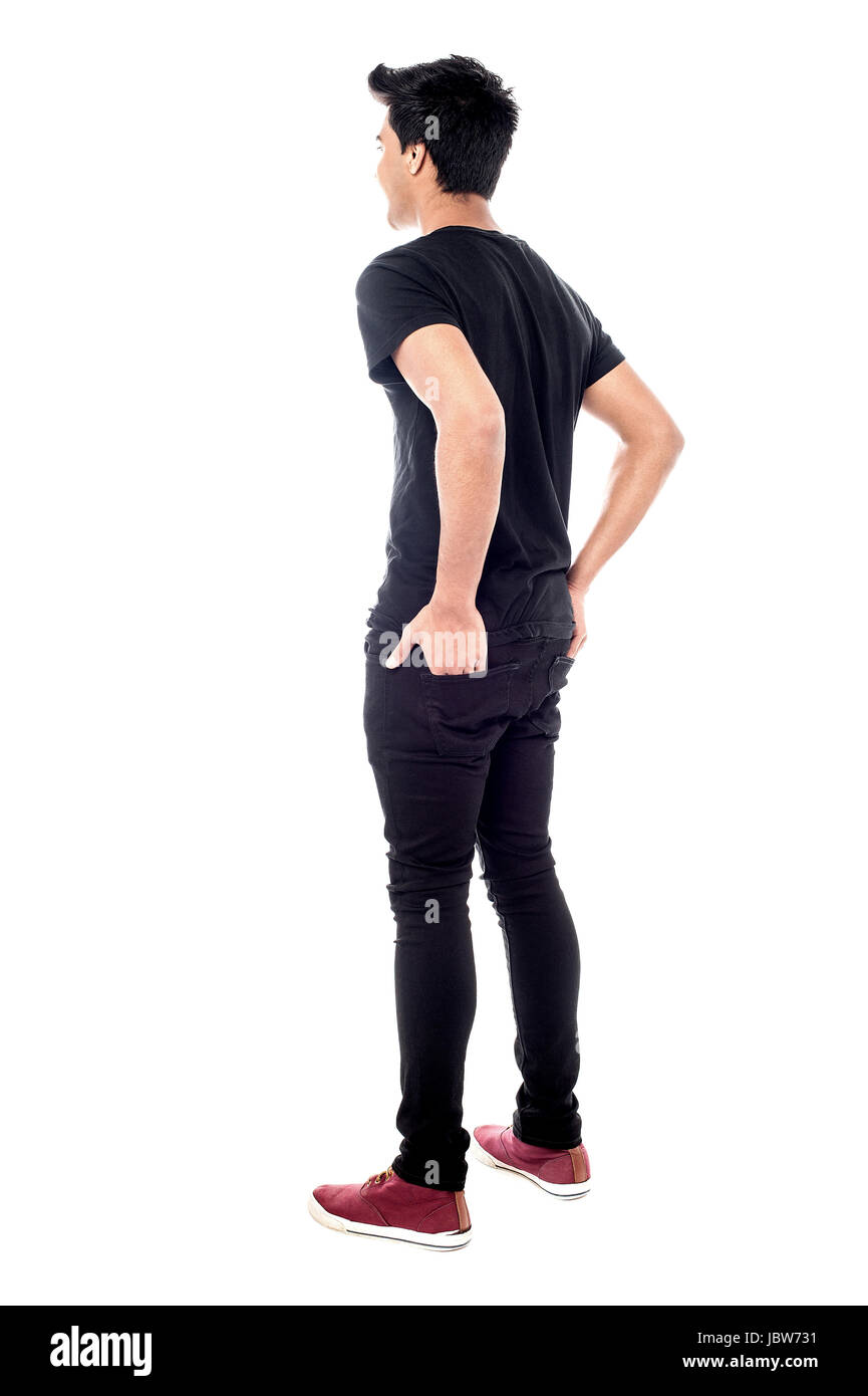 Back view of man looks ahead, hands in pocket Stock Photo - Alamy