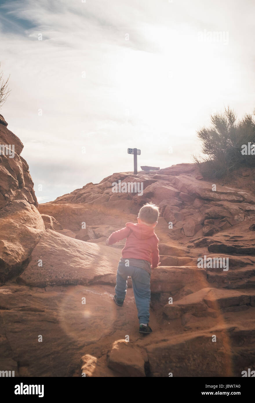 Young boy rock climbing hi-res stock photography and images - Alamy