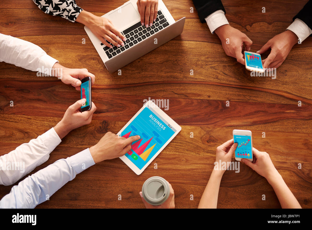 Company workers using some digital devices Stock Photo - Alamy