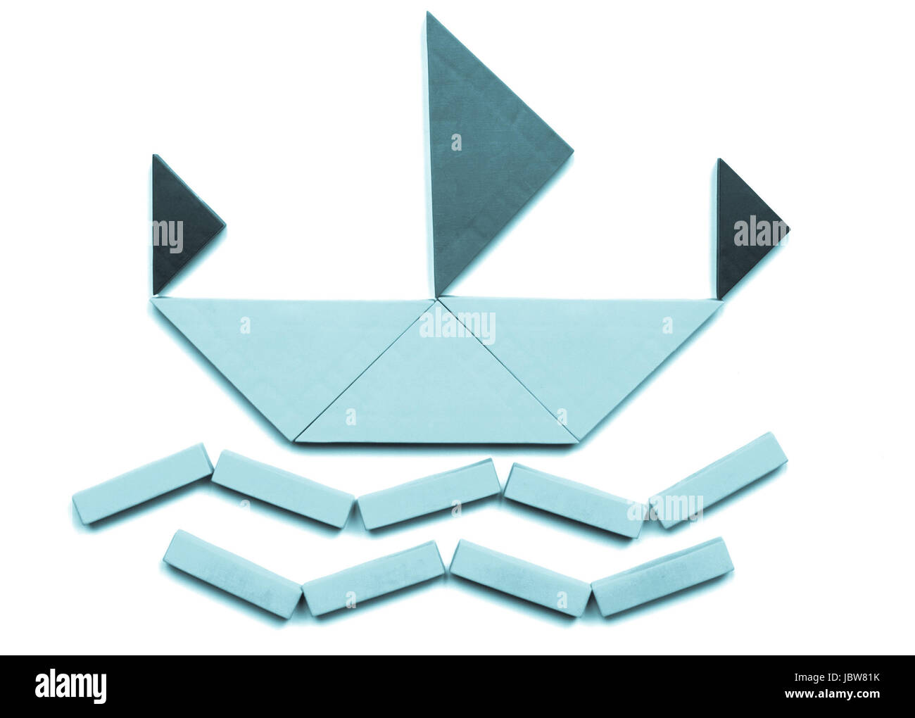 Tangram game toy with ship at sea - cool cyanotype Stock Photo - Alamy