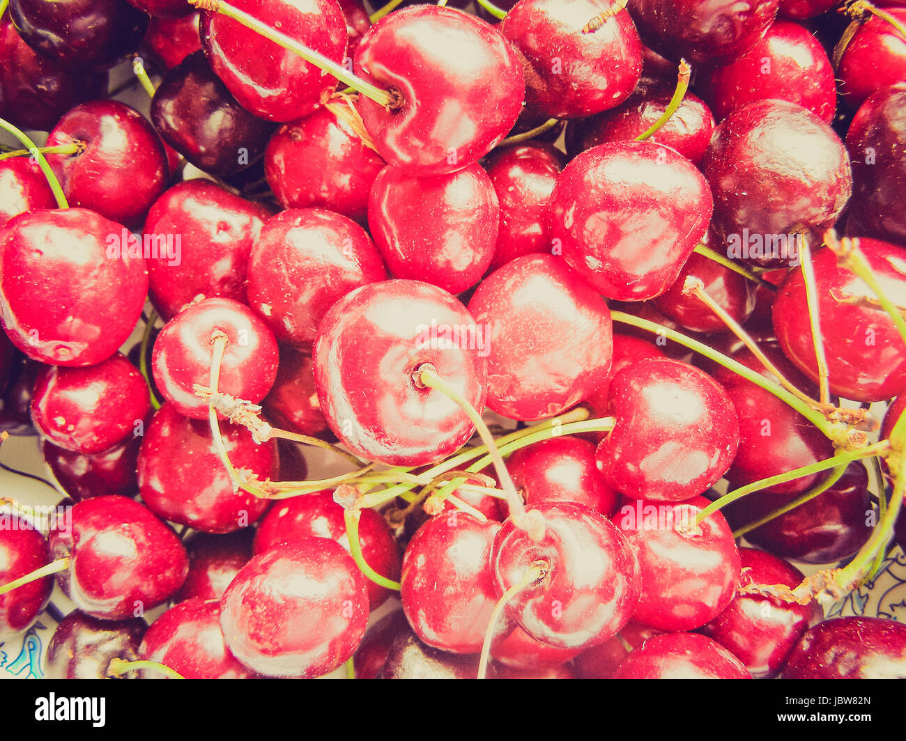 Vintage retro looking Cherry fruits background Stock Photo - Alamy