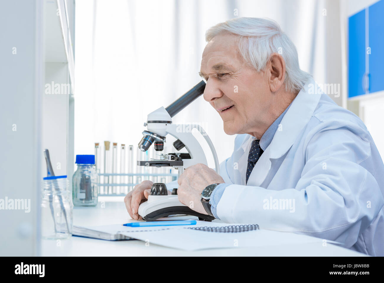 Microscope white coat smiling medical hi-res stock photography and ...