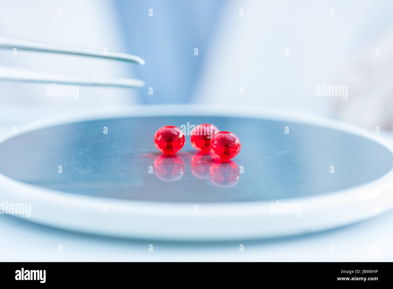 close up view of pills on lab scales Stock Photo - Alamy
