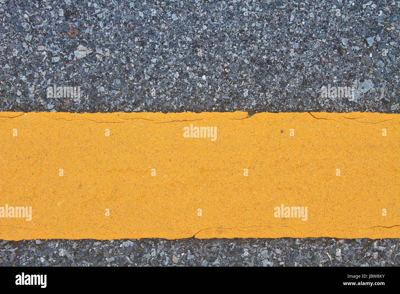 asphalt road with marking lines and tire tracks. Close up photo with ...