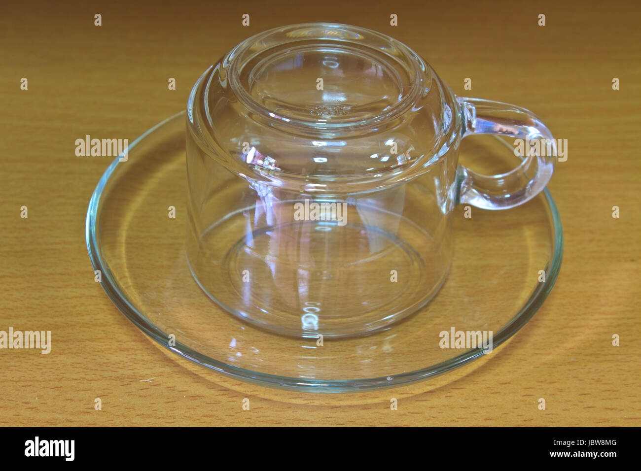 Empty glass tea cup on table wood Stock Photo - Alamy