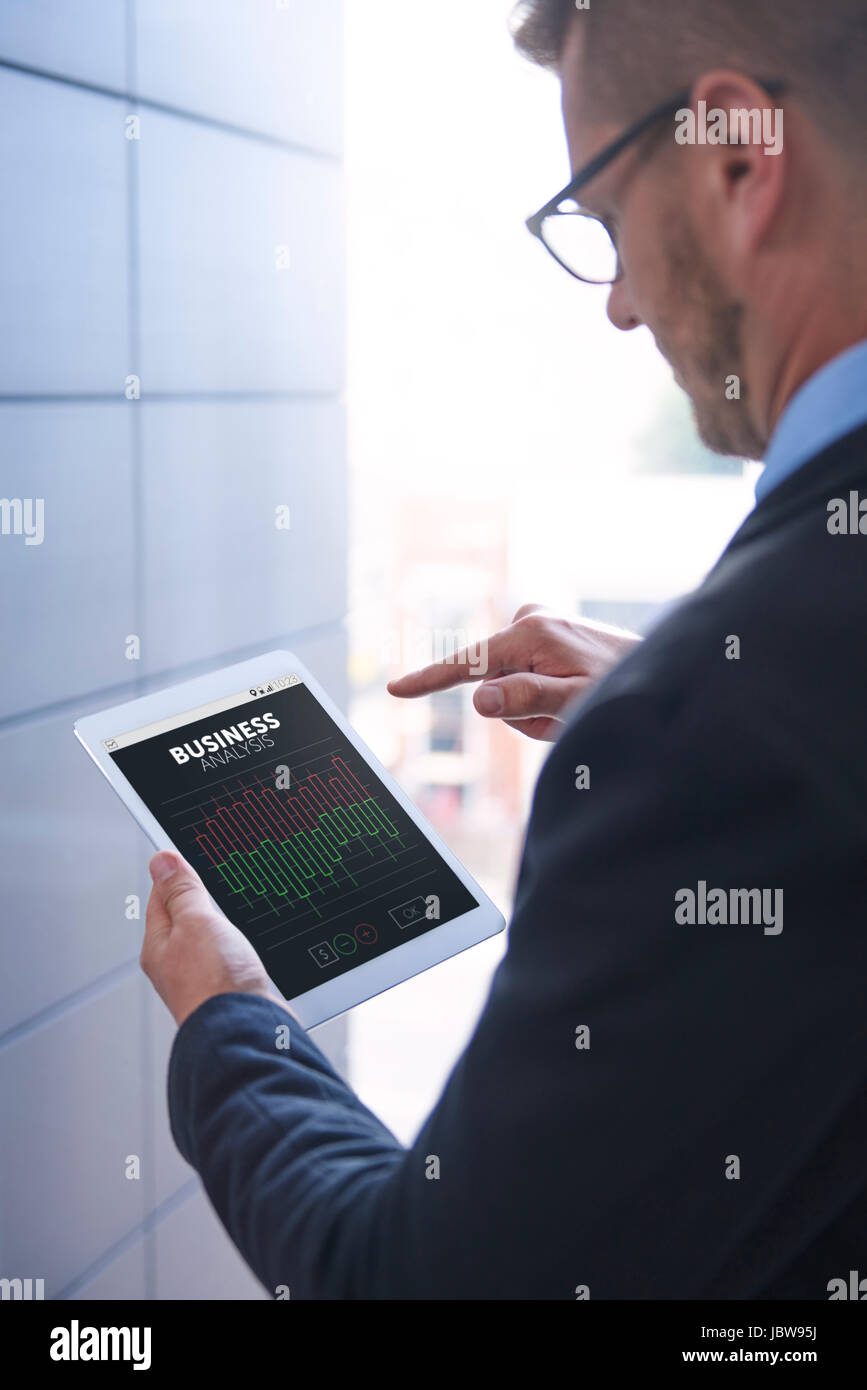 Analyzing current business charts hi-res stock photography and images ...