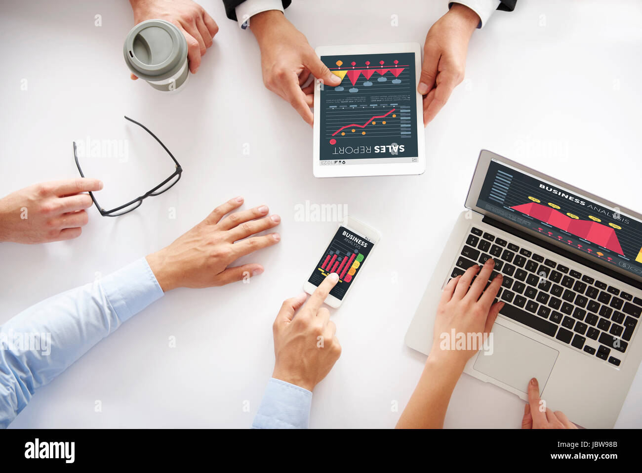 Group hands office table tablet phone hi-res stock photography and ...