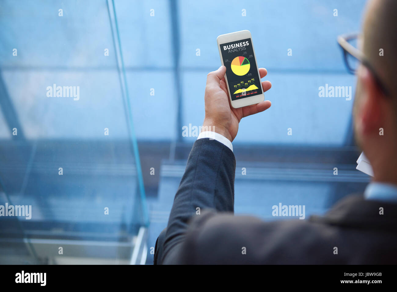 Analyzing bar graph in smart phone Stock Photo - Alamy