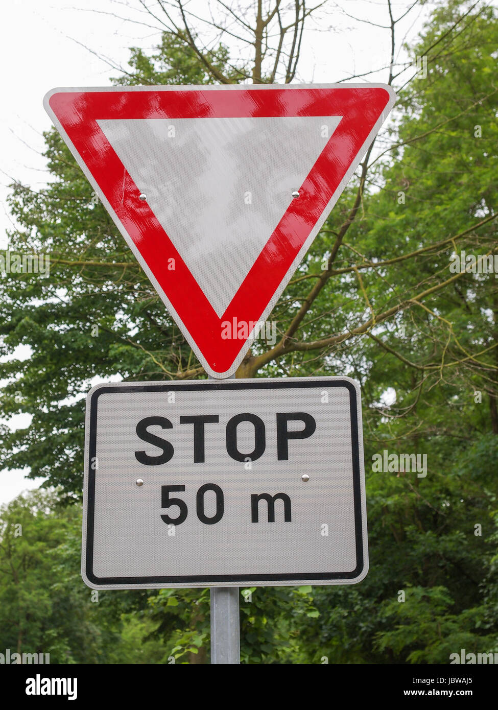 Detail of a traffic sign - Give way and Stop 50 m Stock Photo - Alamy