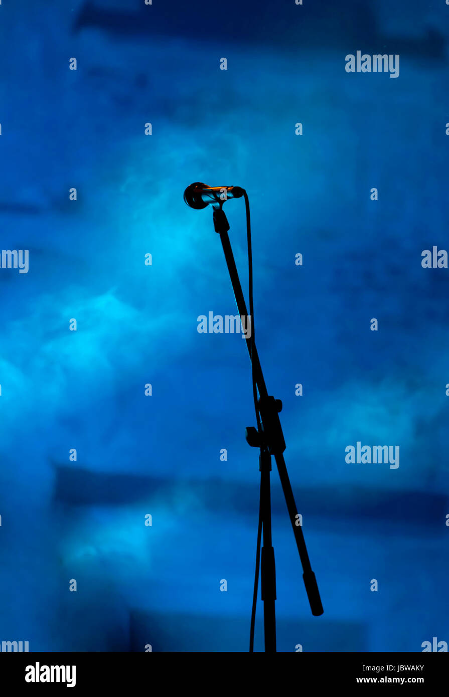 Microphone on empty stage Stock Photo - Alamy