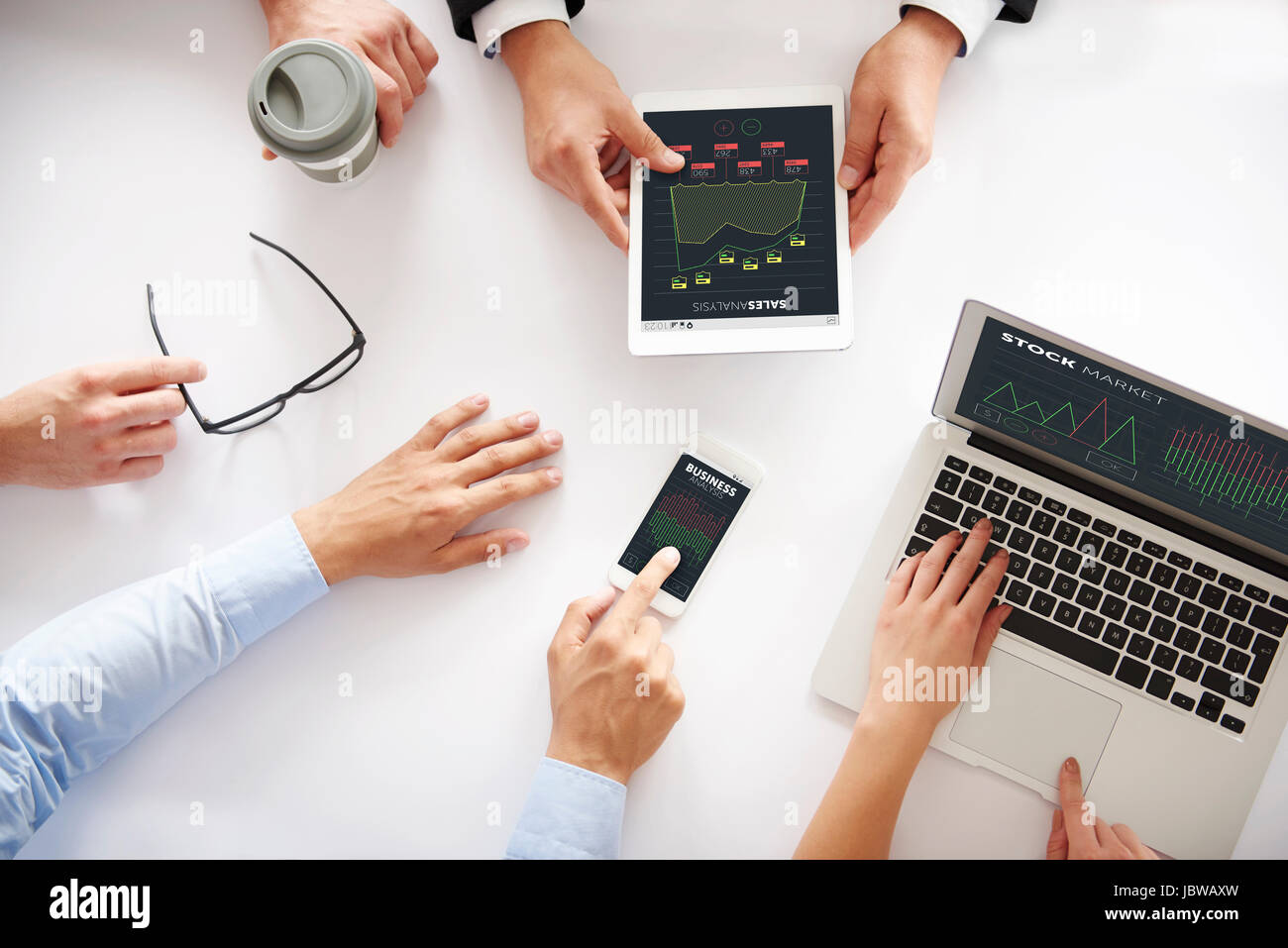 Business people looking at graphs and charts Stock Photo - Alamy