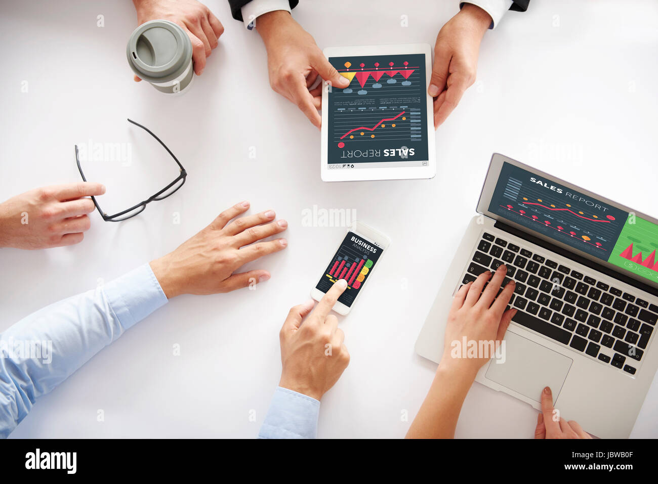 Group hands office table tablet phone hi-res stock photography and ...