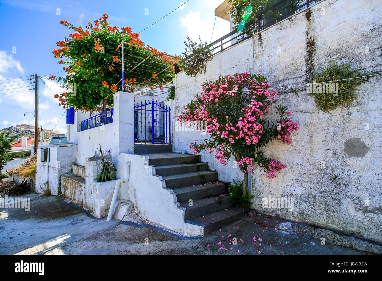 stairs to the blue gate Stock Photo - Alamy