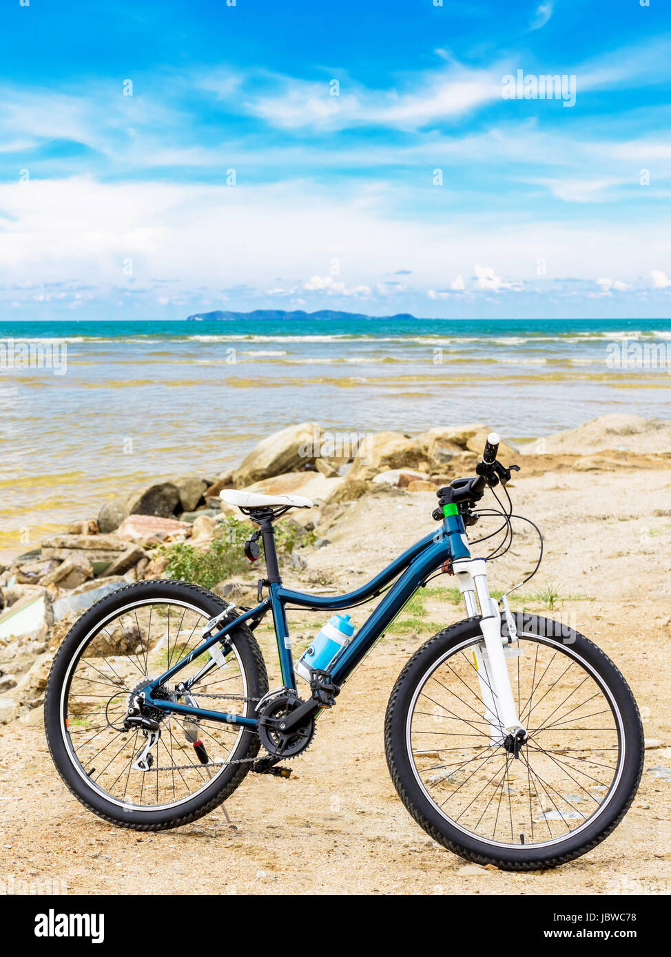 Bicycle at beach with blue sky on daylight Stock Photo - Alamy