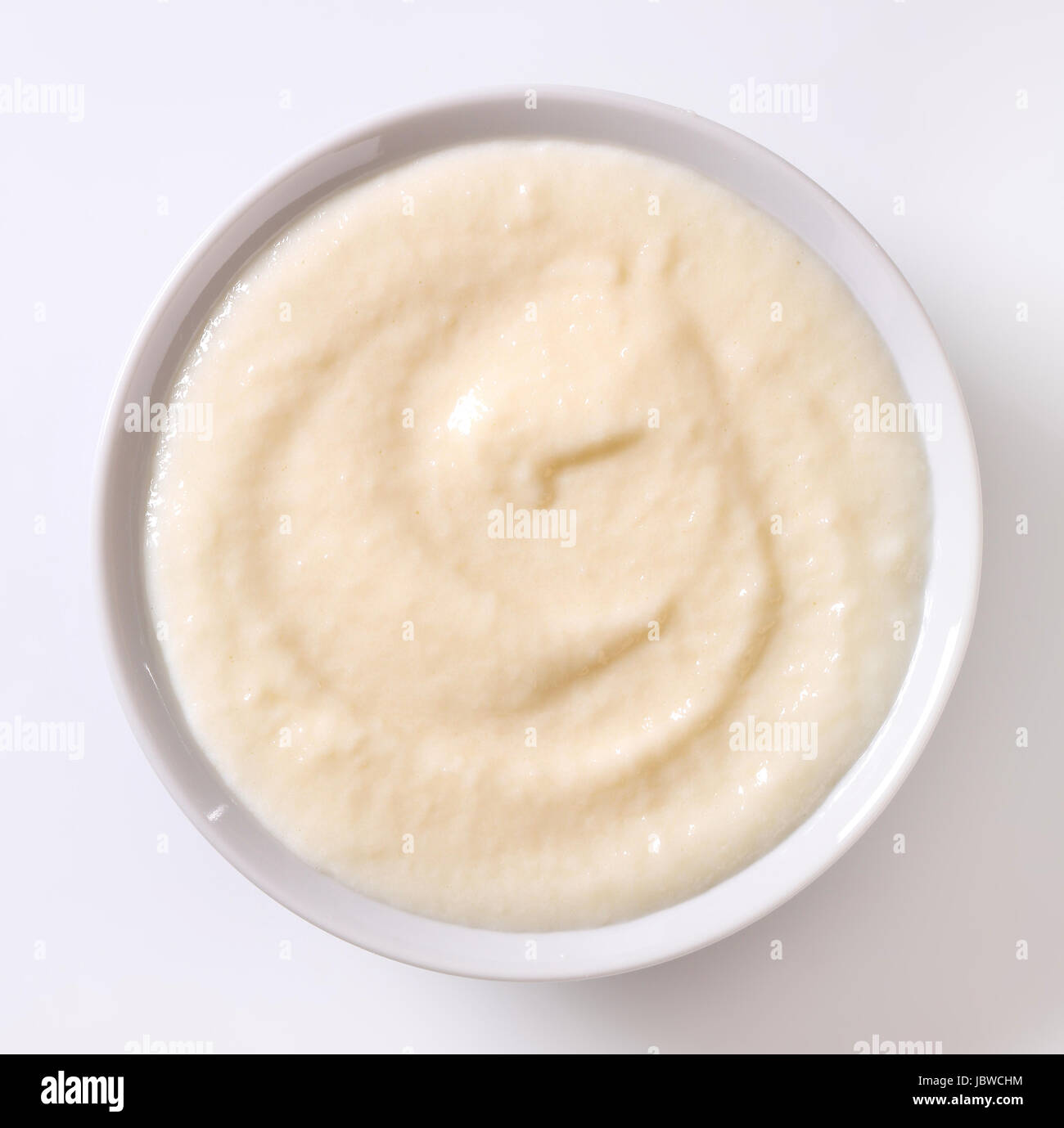 Bowl of smooth milk pudding Stock Photo - Alamy