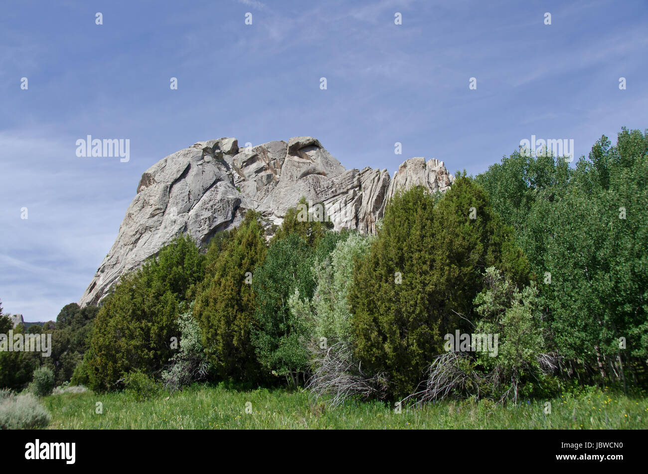 Castle Rock Above the Trees Stock Photo - Alamy