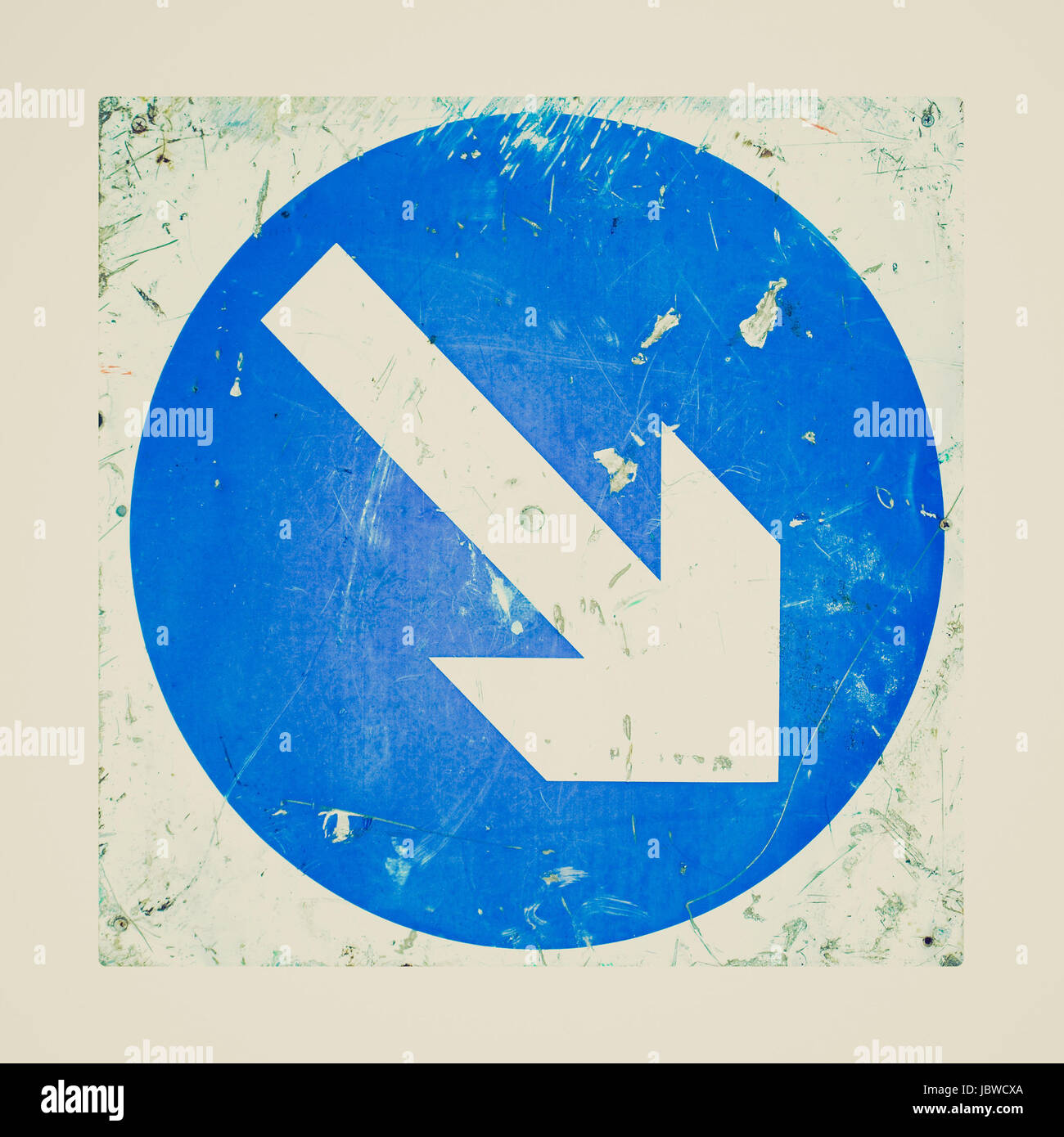 Vintage retro looking Direction sign with white arrow over blue ...