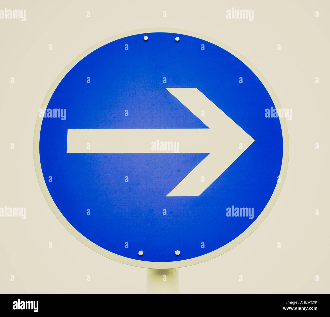 Vintage retro looking Arrow sign showing street road driving direction ...