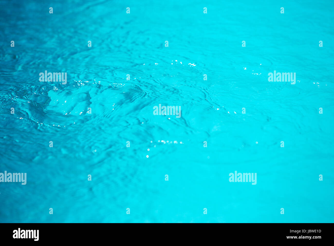 Close-up of blue water waves in a swimming pool Stock Photo - Alamy
