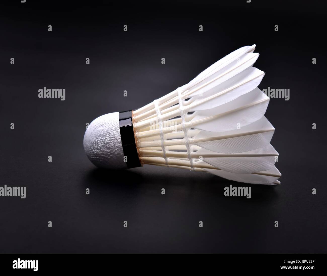 new shuttlecock on dark floor Stock Photo - Alamy