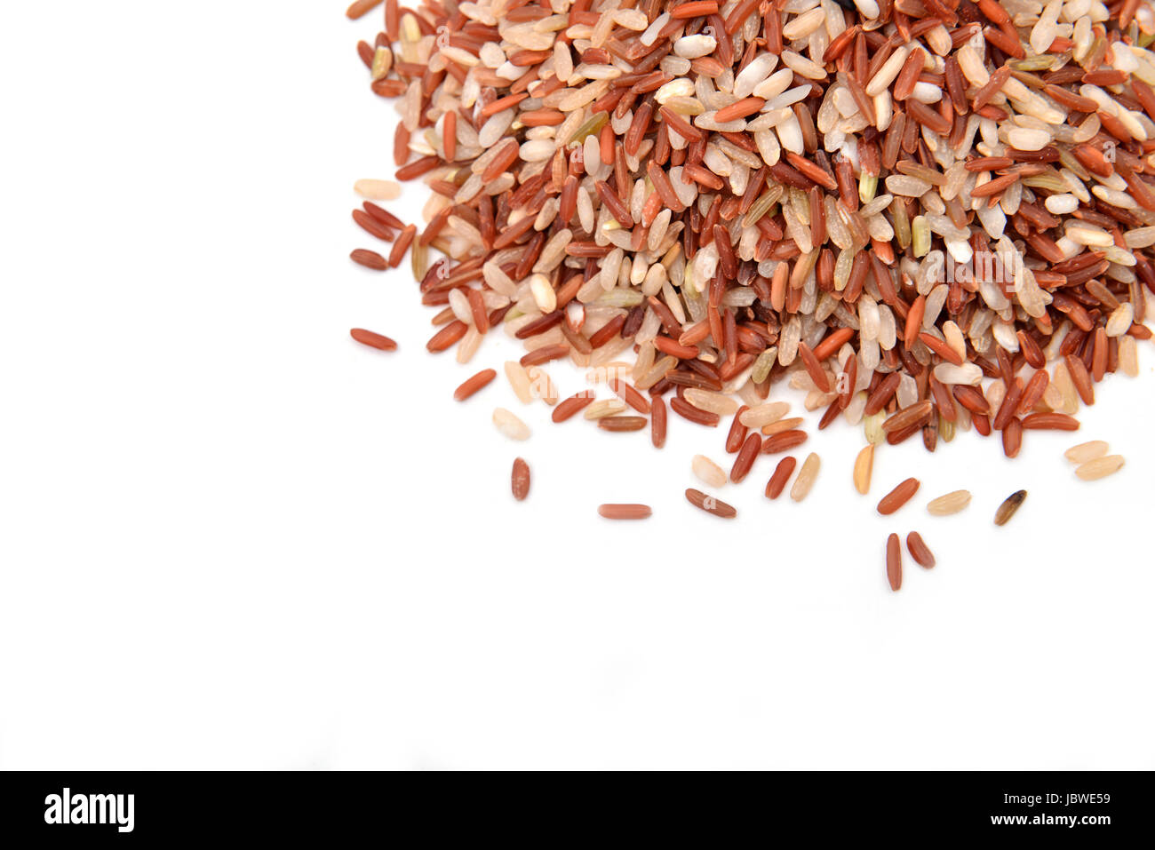 milled rice imperfectly cleaned on white background Stock Photo - Alamy