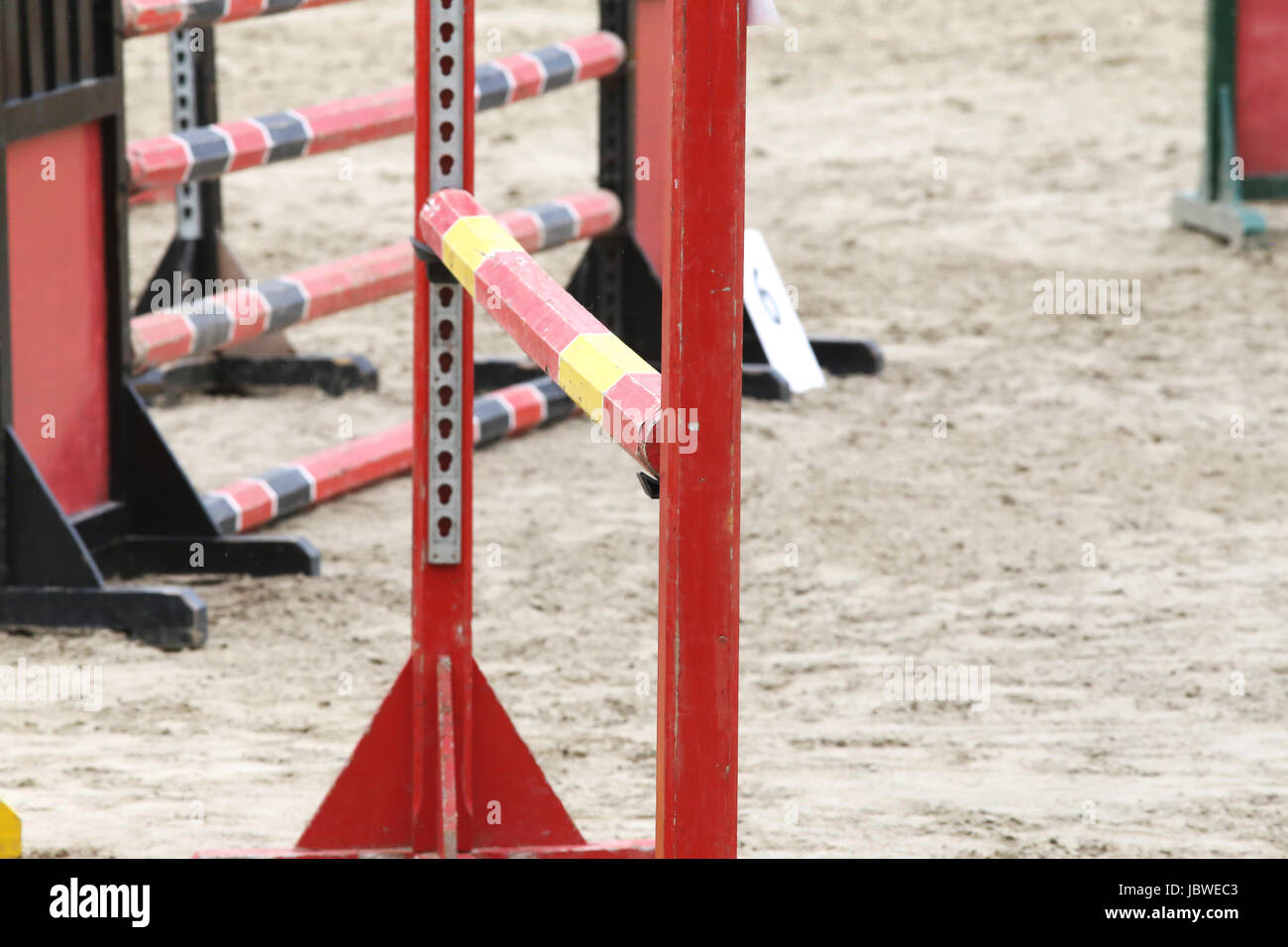 Old retro wooden barriers on the ground for jumping horses and riders ...