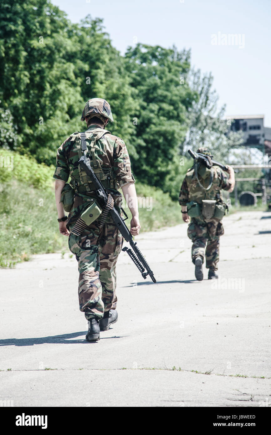 Two NATO soldiers during the military operation Stock Photo - Alamy