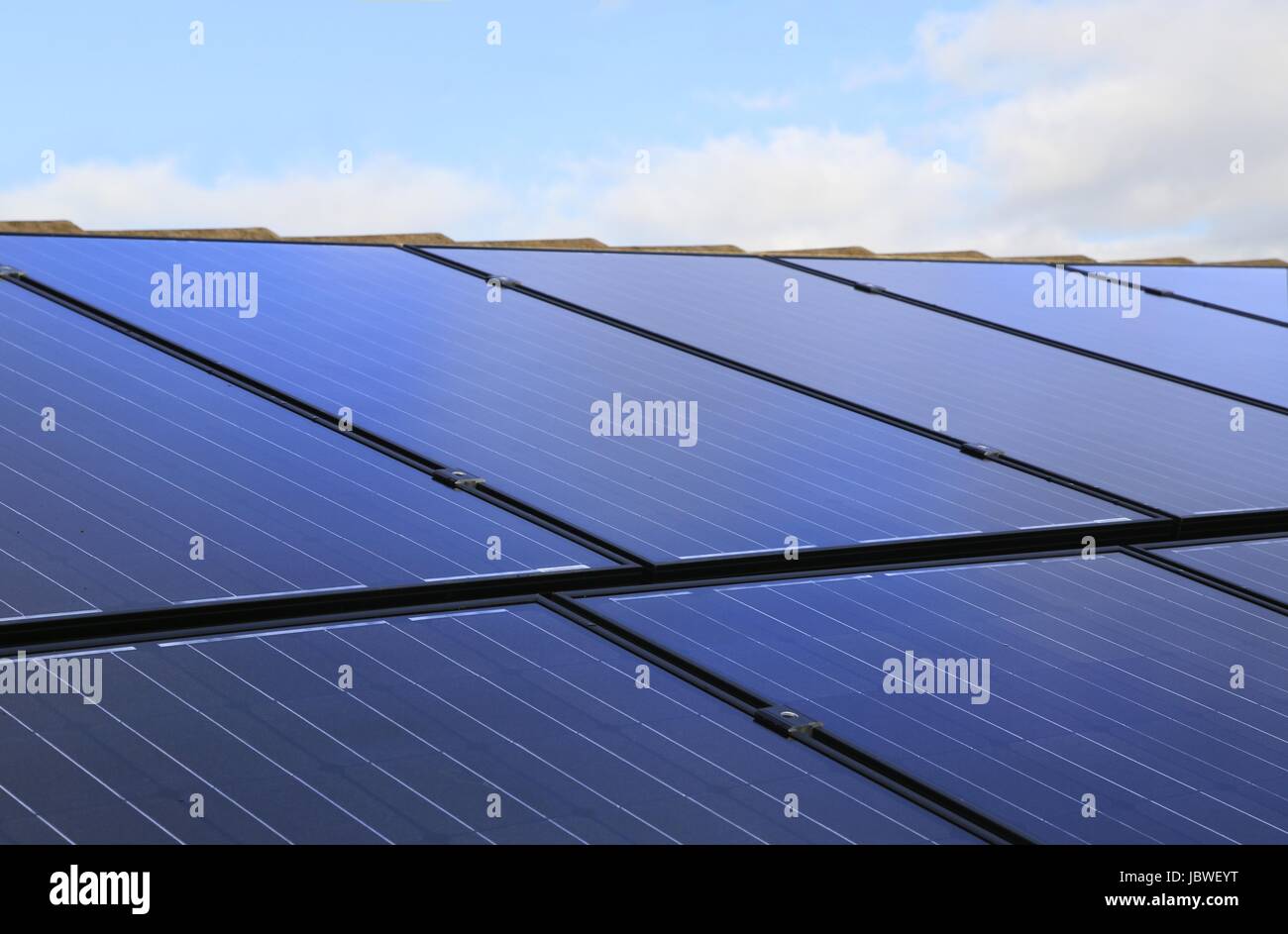 Close-up of solar panels on a house roof Stock Photo - Alamy
