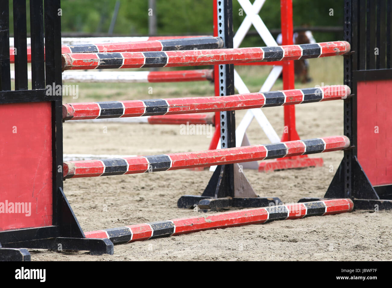 Obstacles for riders on the race course against green natural ...