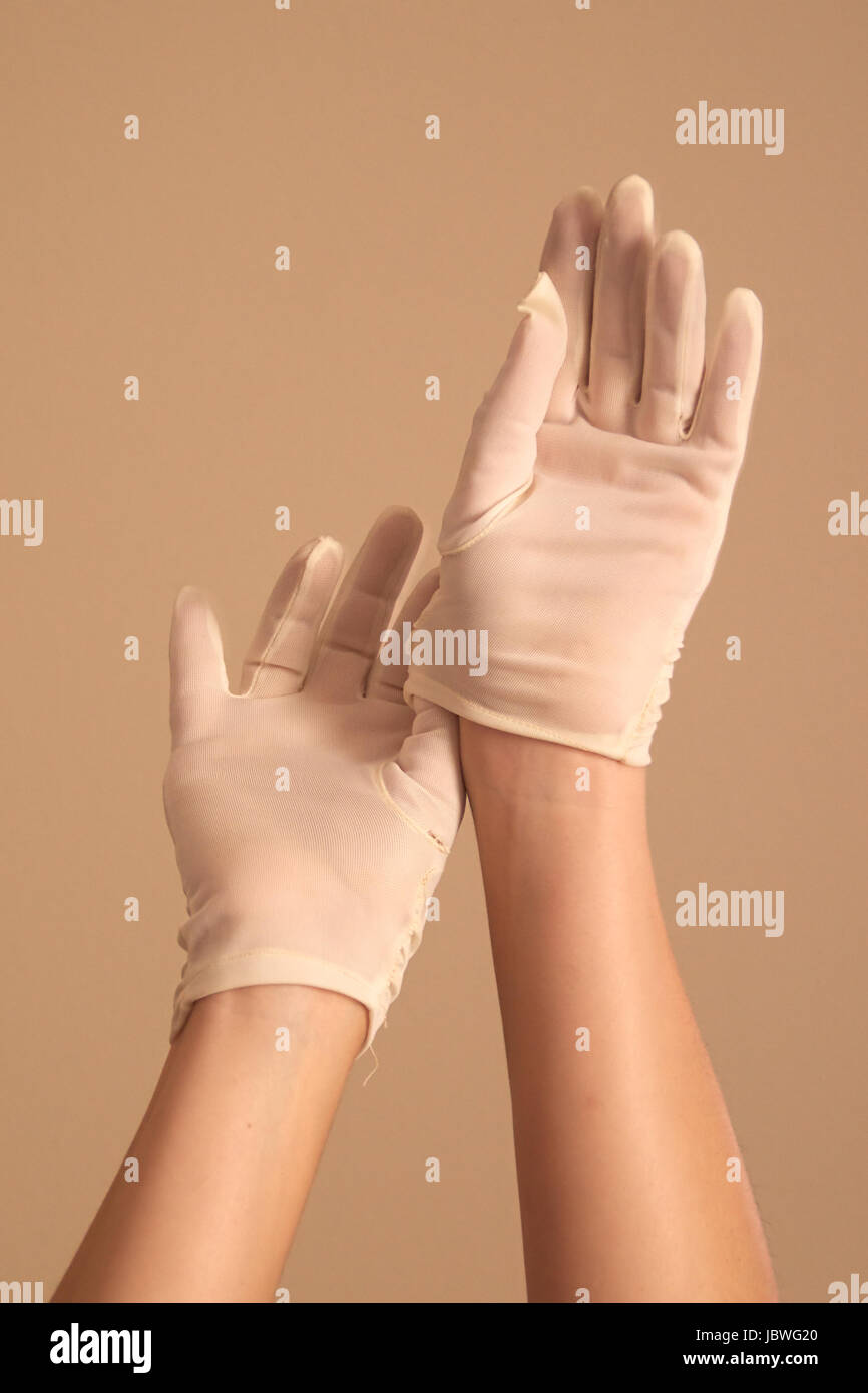 A woman's hands and forearms are shown as she models a vintage pair of ...