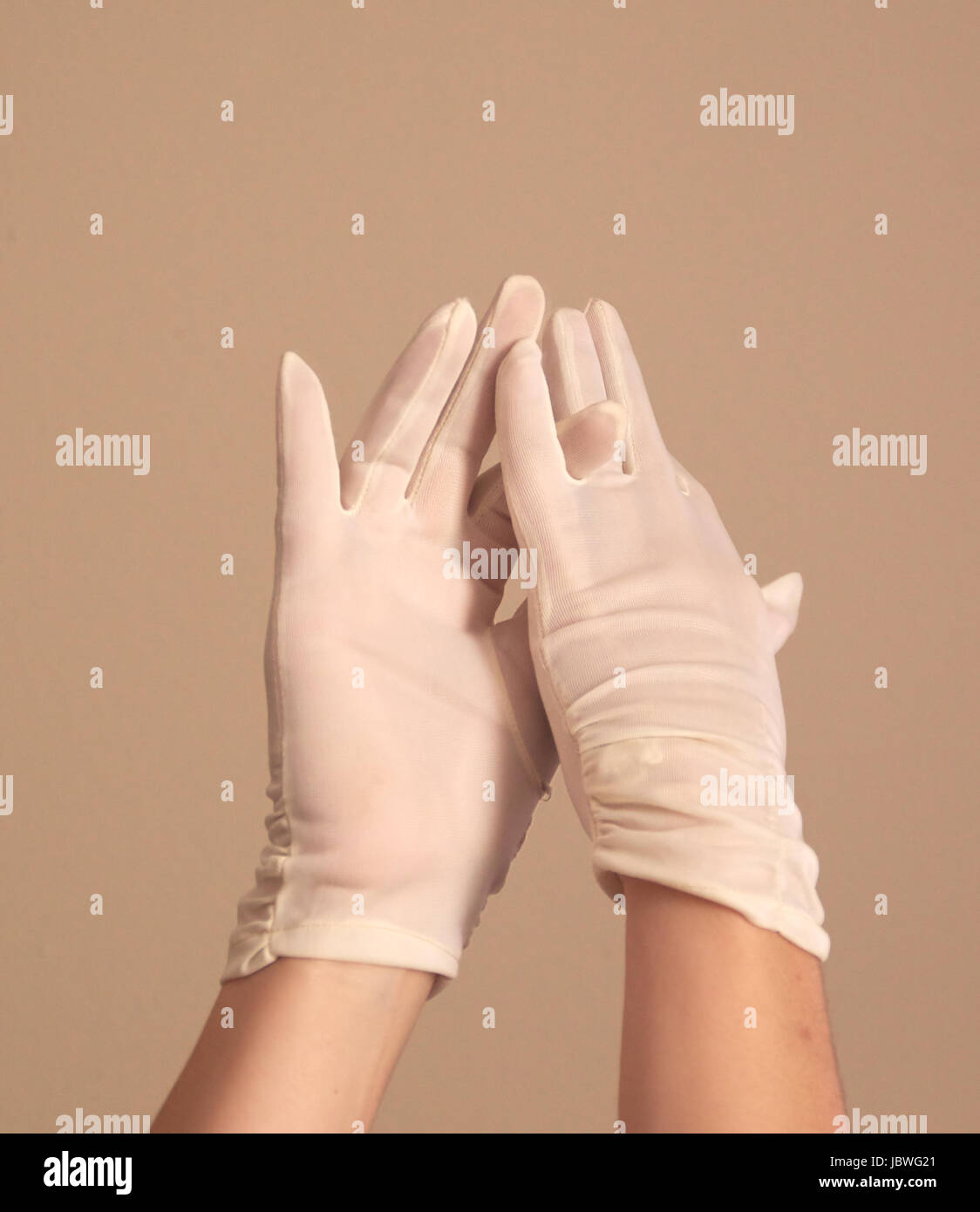 A woman's hands and forearms are shown as she models a vintage pair of ...