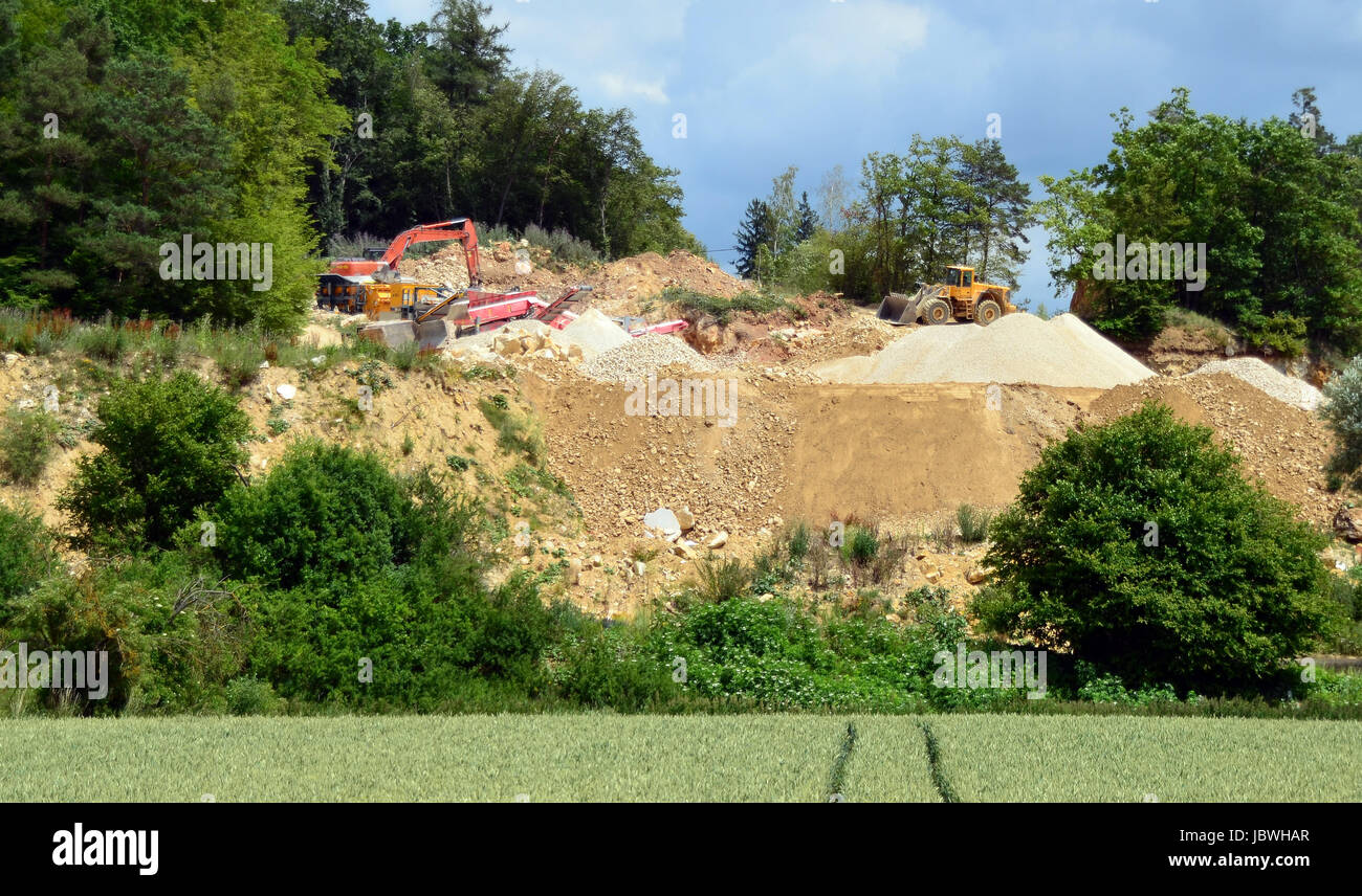 Vehicles working in quarry in hi-res stock photography and images - Alamy