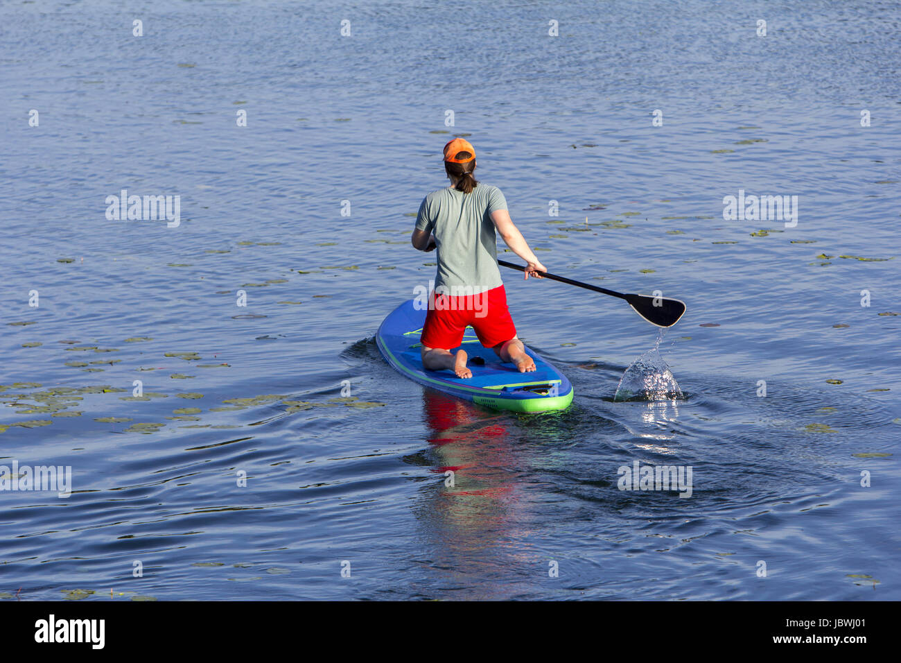 Paddling out into surf hi-res stock photography and images - Alamy