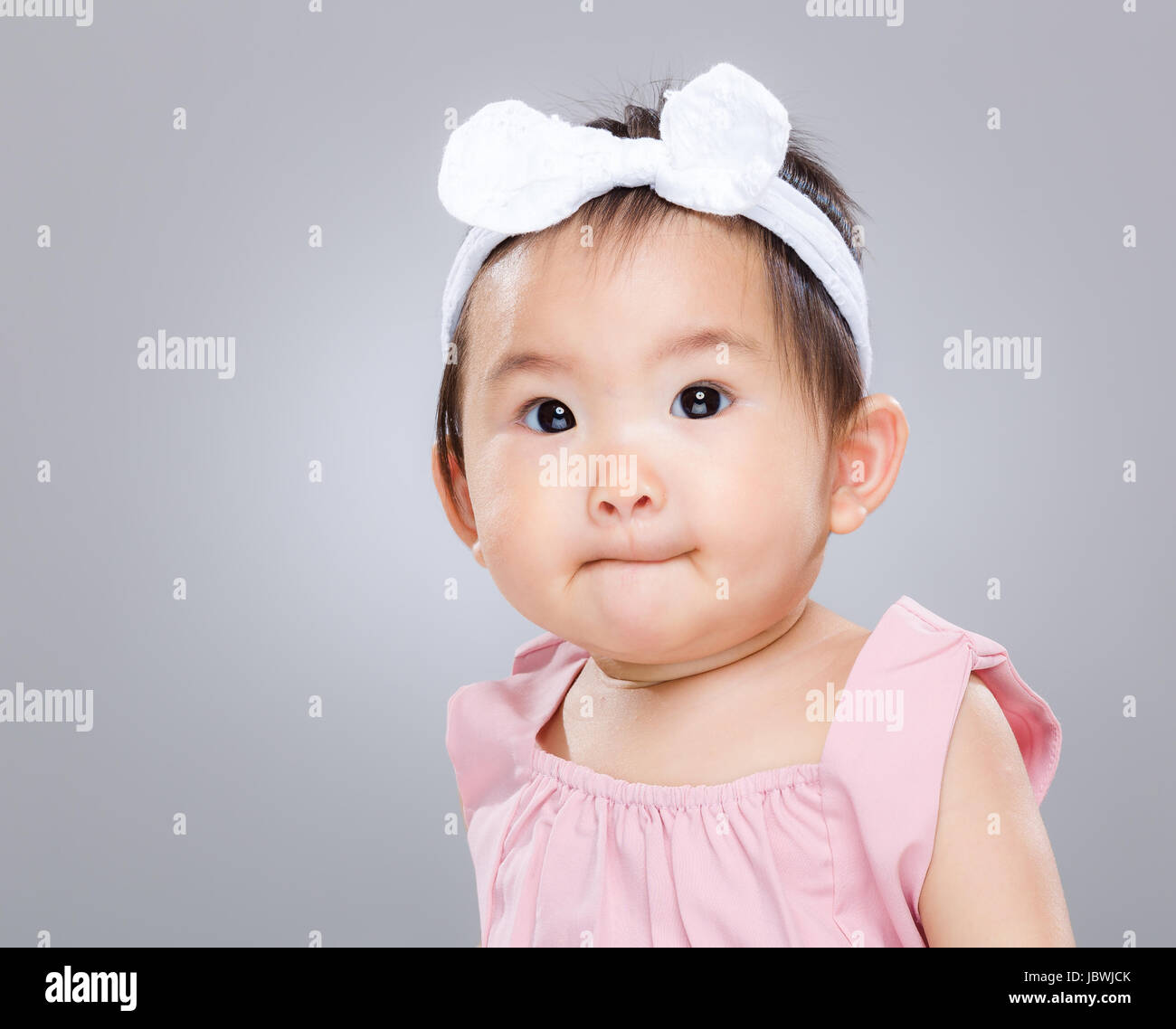 Cute baby close mouth Stock Photo - Alamy