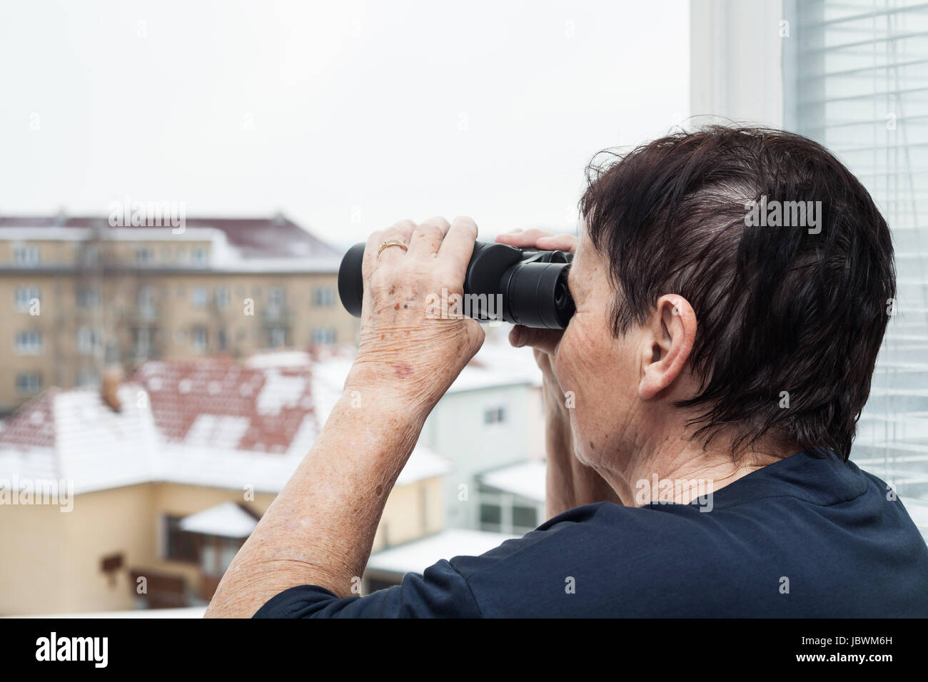 Woman spy binoculars senior hi-res stock photography and images - Alamy