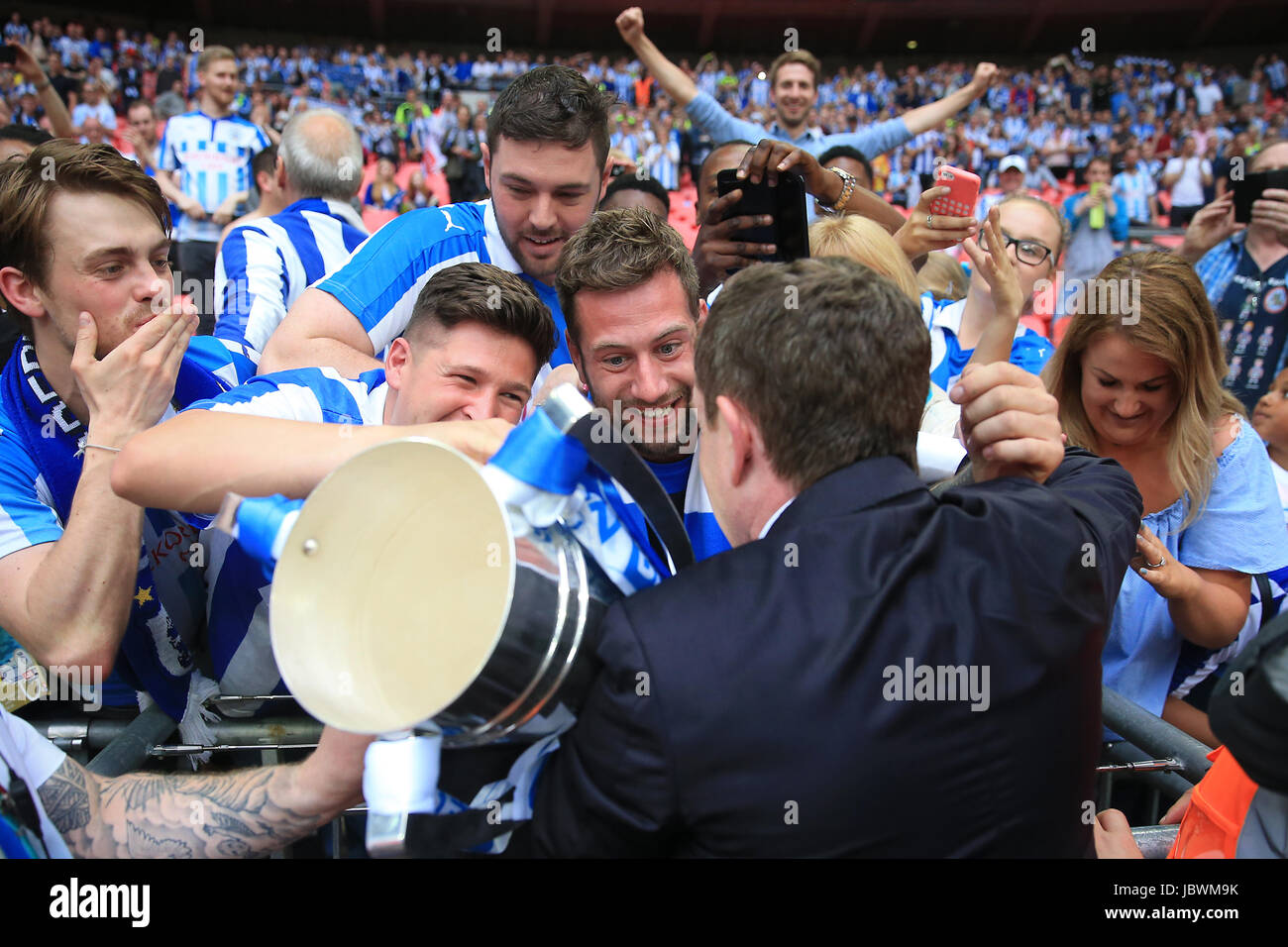 Huddersfield Town chairman Dean Hoyle with the trophy after winning the ...