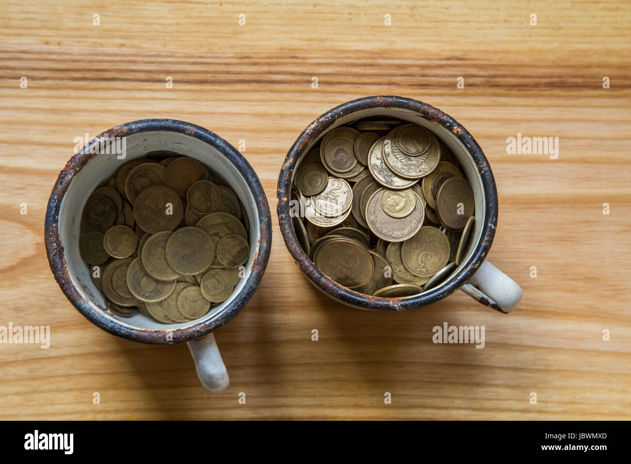 Old soviet coins in a rusty enamel cup on a wooden background Stock ...
