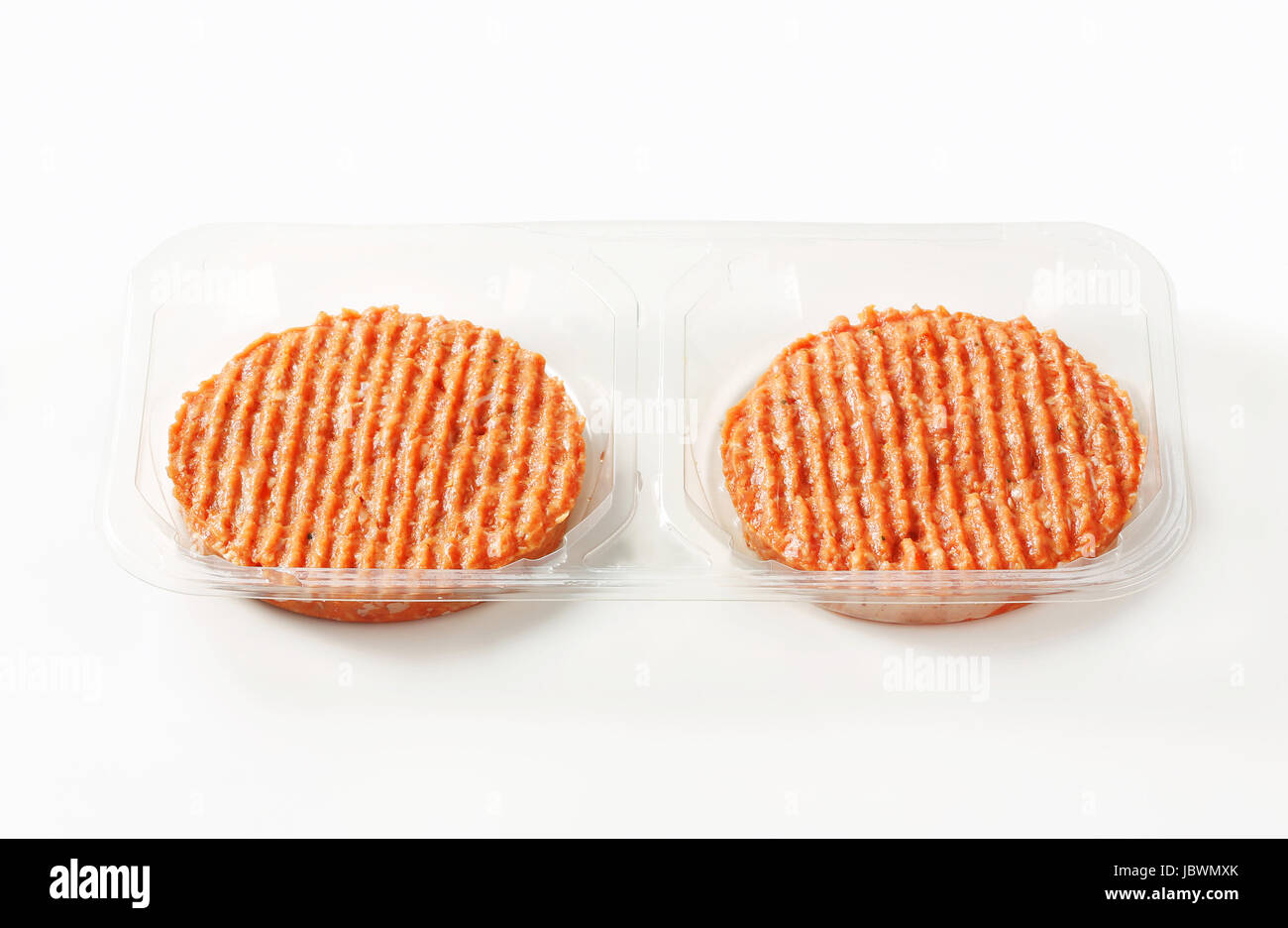 Raw burger patties in plastic packaging Stock Photo - Alamy