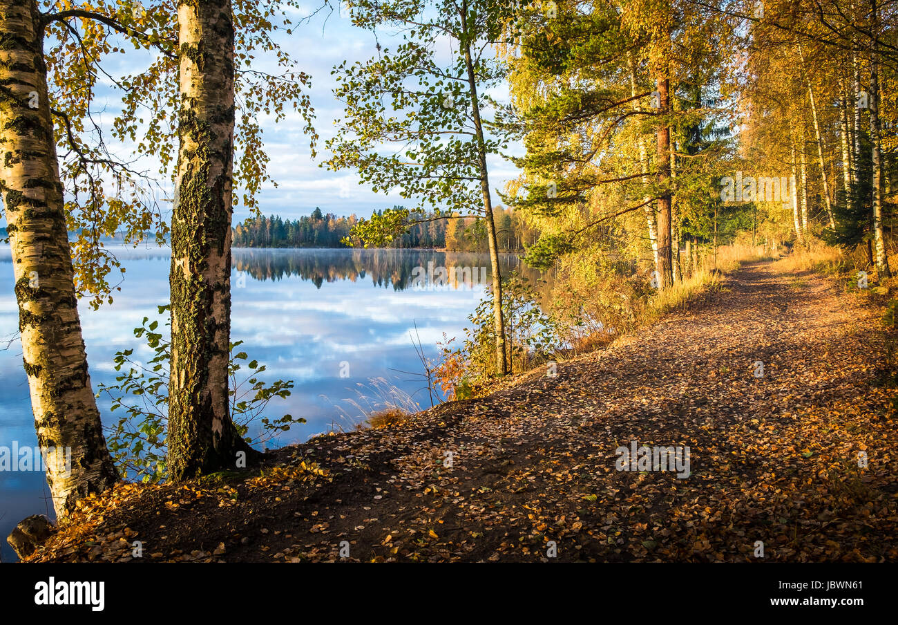 Scenic landscape with lake and fall colors at morning light Stock Photo ...
