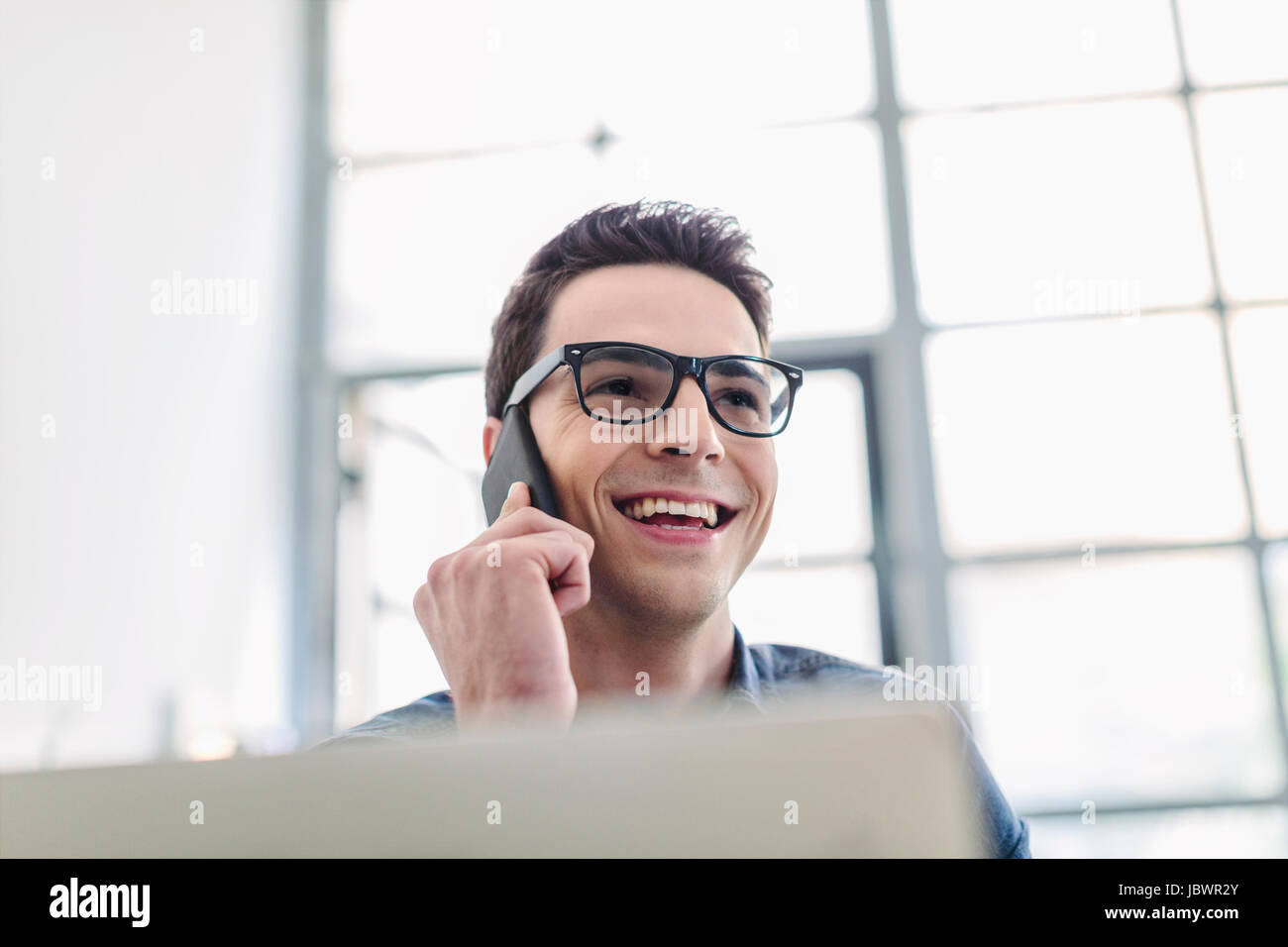 Man making phonecall using mobile phone Stock Photo - Alamy