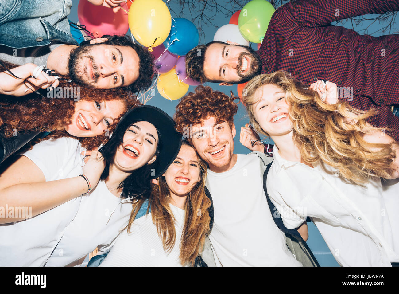 Leaning heads together hi-res stock photography and images - Alamy