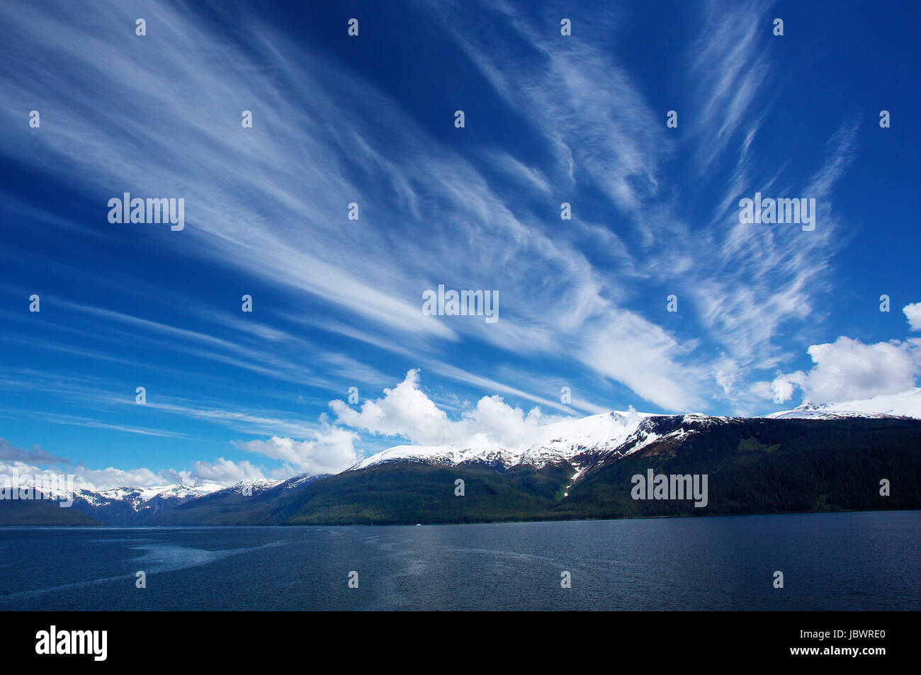 Alaskan Sky and snow topped mountain in Turnagain Arm Stock Photo - Alamy